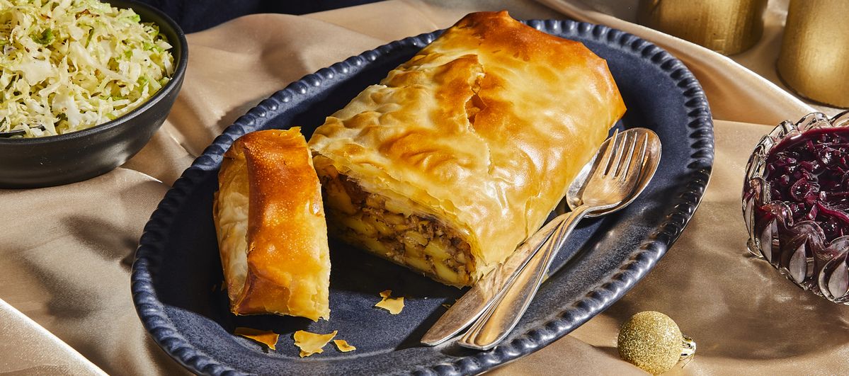 Savoury potato and hazelnut strudel with braised cabbage and red wine sauce